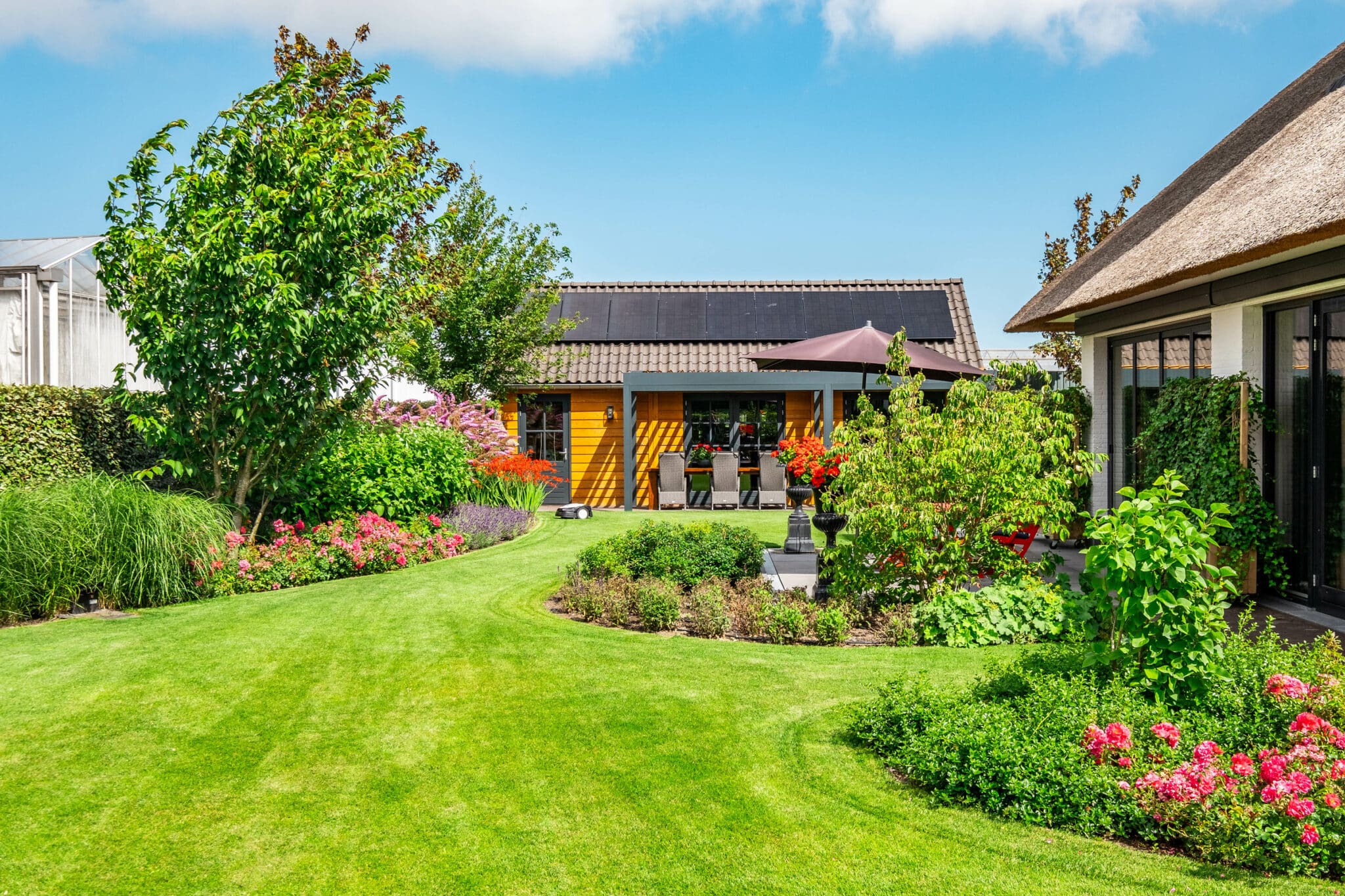 Gooische villa tuinontwerp: landelijk & modern